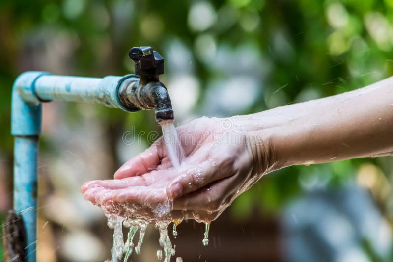 Hand Holding the Water Flow Stock Image - Image of hand, green: 249282013