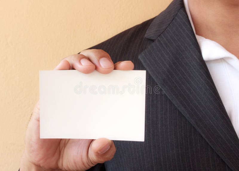 Hand holding a white card stock photo. Image of credit - 67330046