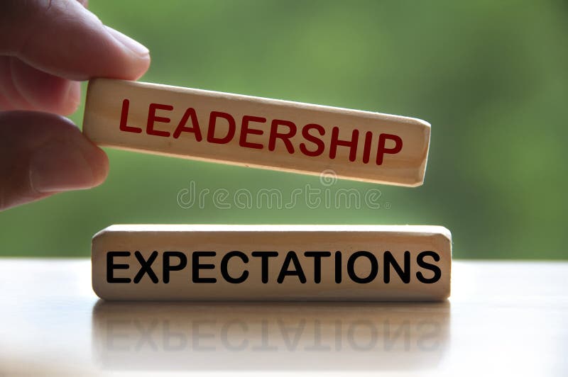 Hand Holding Wooden Blocks with Text - Leadership Expectation. Stock ...