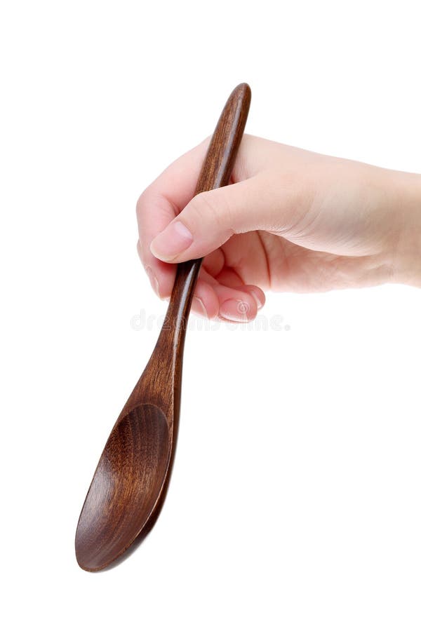 Hand holding wooden spoon stock photo. Image of bright - 85522494