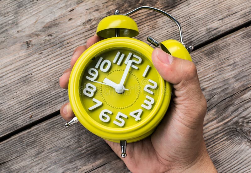 Yellow Alarm Clock at 9 O Clock Stock Photo - Image of wood, time: 48469028