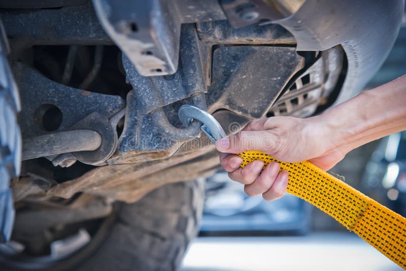 Hand Holding Yellow Car Towing Strap with Car Stock Image - Image of ...