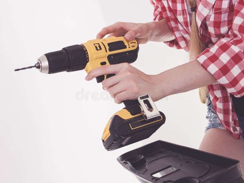 Hand holding yellow drill stock photo. Image of drilling - 185045926
