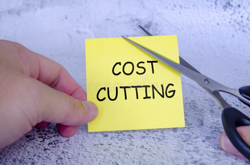 Hand Holding a Yellow Sticky Note with the Words Cost Cutting Written ...