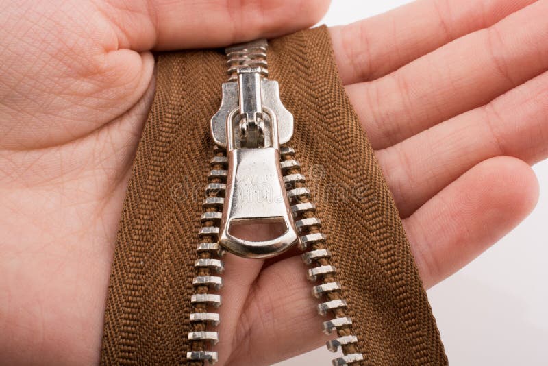Hand holding zipper stock image. Image of material, clothing - 118335651