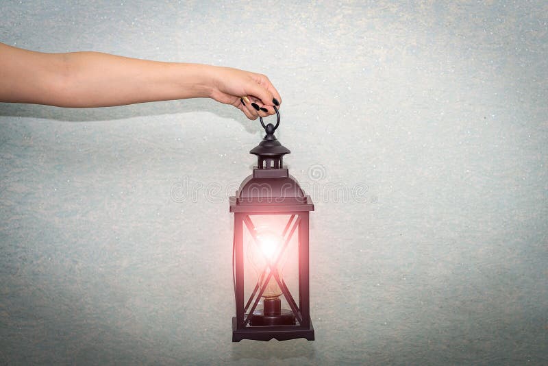 The Hand Holds the Antique Lamp, the Lamp Illuminates the Space Stock ...