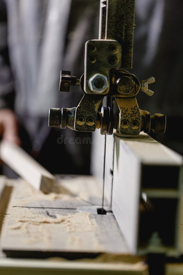 The Hand Holds the Bar on the Surface of the Jig Saw on a Blurred ...