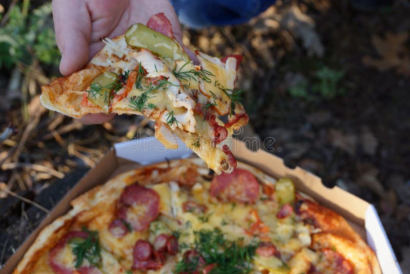 Hand Holds a Big Slice of Pizza Stock Image - Image of large, holds ...