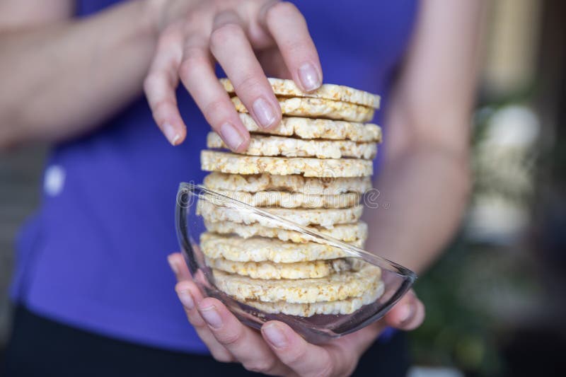 A Hand Holds a Bowl of Corn Chips Close-up. the Process of Eating a ...