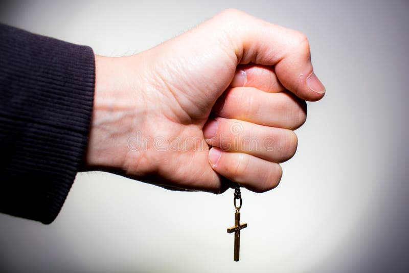 Hand Holds a Chain with Gold Crucifix Stock Image - Image of church ...