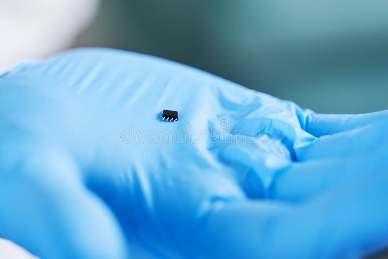 Hand Holds Chip Compenent. Embedding the Chip Under Human Skin ...