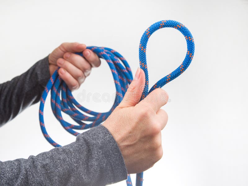 Hand Holds Colored Rope for Climbing Equipment. Item for Camping and ...