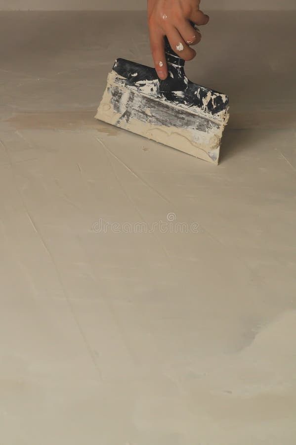 Hand Holds Construction Spatula with Putty. Trowel with Spackling ...