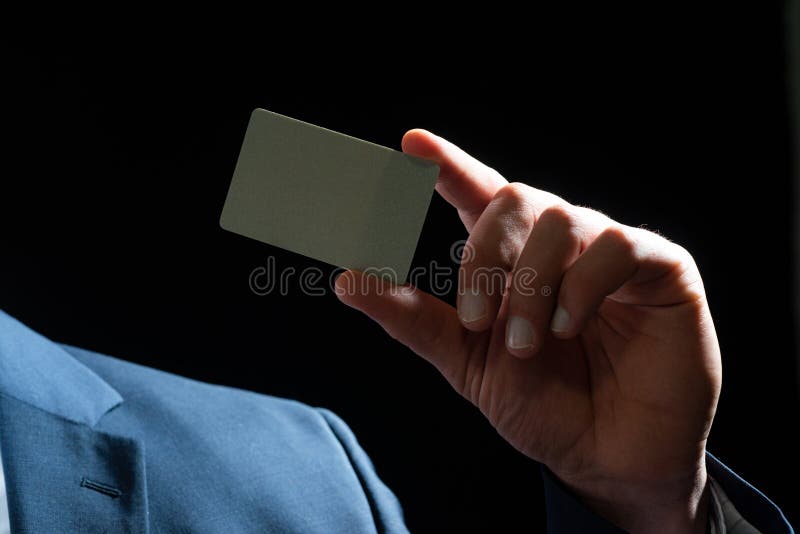 Hand holds a credit card. stock photo. Image of exchange - 195459036