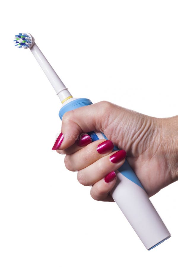 Hand Holds Electric Toothbrush Against White Stock Image - Image of ...