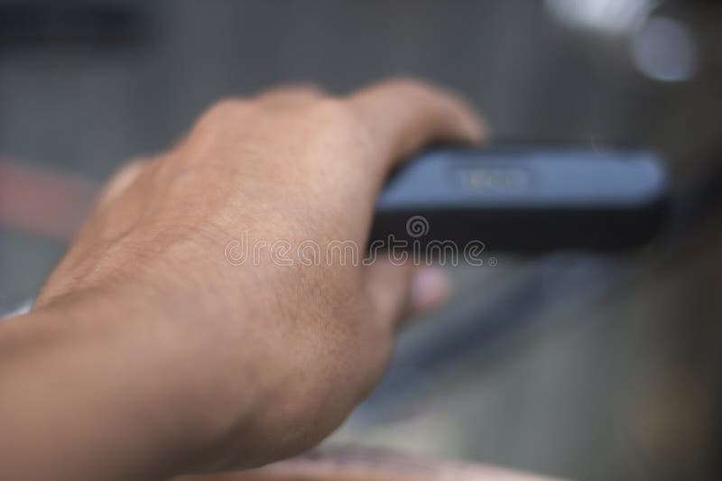 A Hand Holds the Handle of a Bicycle and the Background Blurred Stock ...