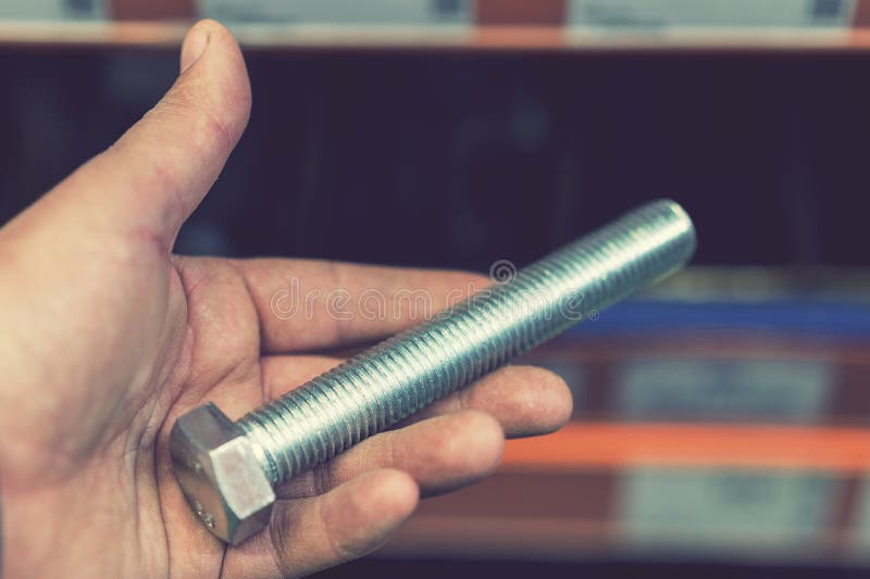 Hand Holds an Iron Bolt. Repair Concept Stock Image - Image of metal ...