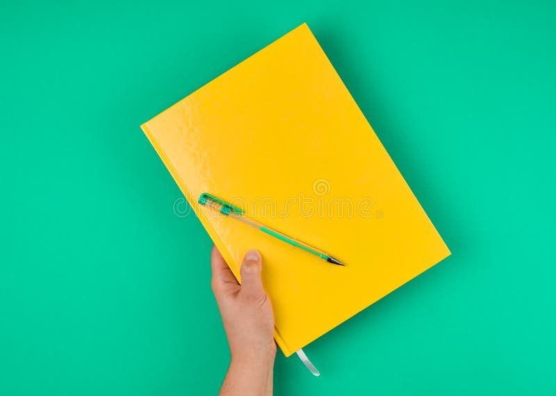 Hand Holds Large Closed Yellow Notebook Stock Image - Image of colour ...