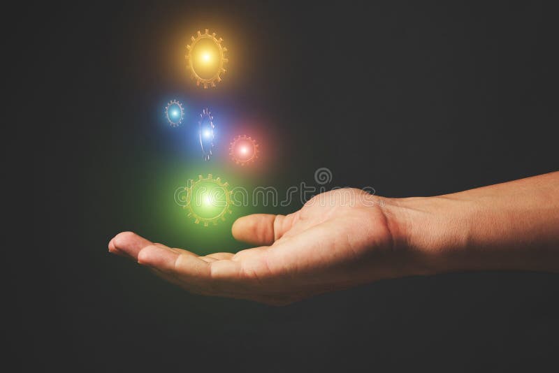 Hand Holds Levitating Gears Glowing in Different Colors.Concept of ...