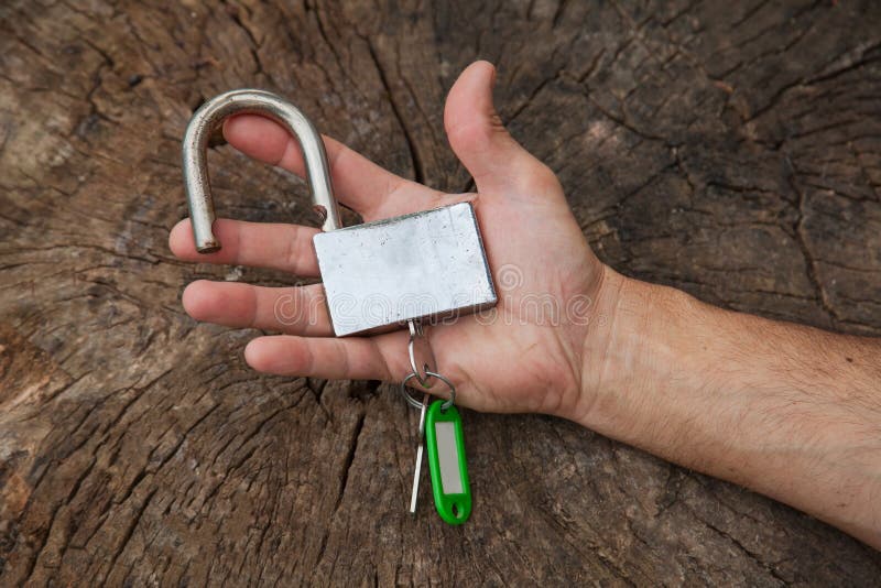 Hand holding old padlock stock photo. Image of padlock - 63598044