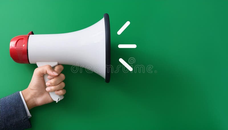 A Hand Holds a Megaphone, Pointing Toward a Green Screen Stock ...