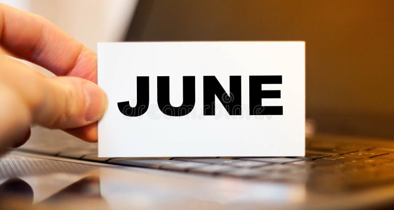 Hand Holds a Paper with the Name of the Summer Month - June Stock Image ...