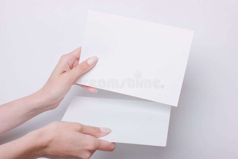 Hand Holds A5 Paper For Presentation Or Design Insert Stock Photo ...