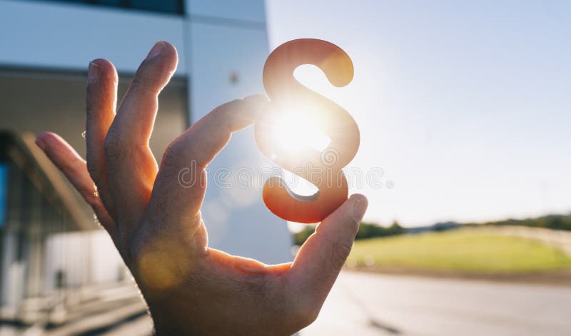 Hand Holds Paragraph in the Sun As a Sign of Justice Stock Image ...
