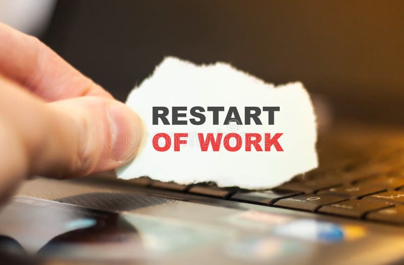 Hand Holds RESTART of WORK on Torn Paper with Computer Background Stock ...