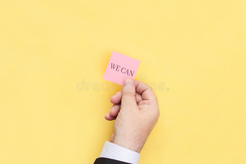The Hand Holds a Sticky Note with Inscription we Can Stock Photo ...
