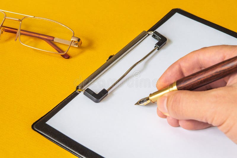 The Hand Holds Stylish Pen for Writing Text on a Blank Sheet of Paper ...