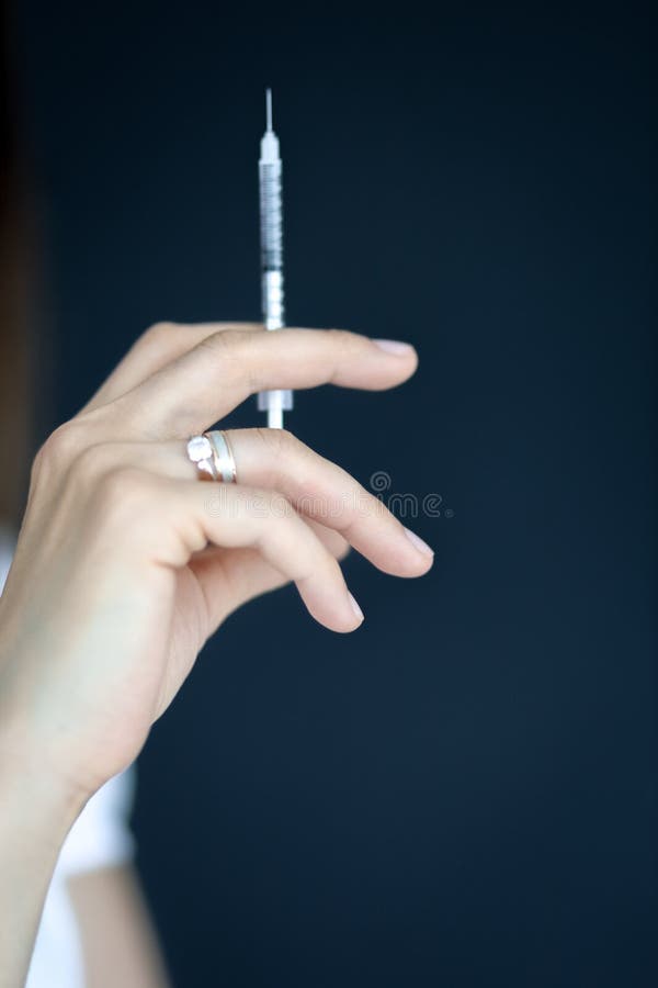 The Hand Holds a Syringe with a Vaccine. the Concept of Vaccination or ...