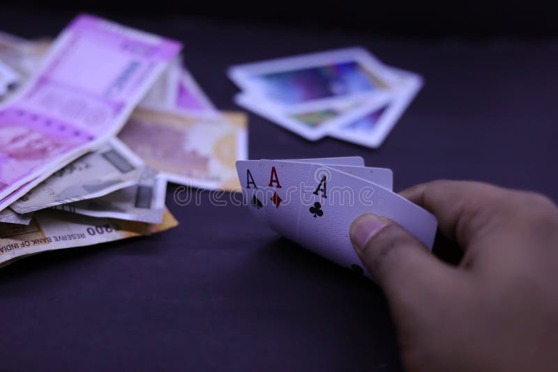 Hand Holds Three Aces on a Black Background. Close Up. Stock Image ...