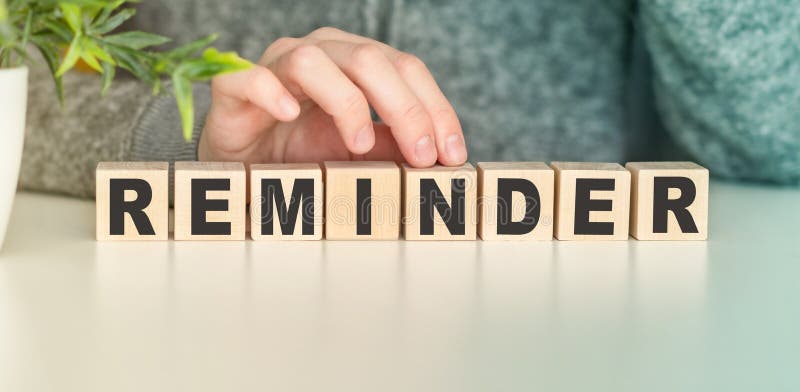 Hand Holds a Wooden Cube with the Text REMINDER Stock Photo - Image of ...