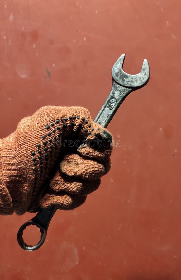 A hand holds a wrench stock image. Image of holds, hand - 269477183