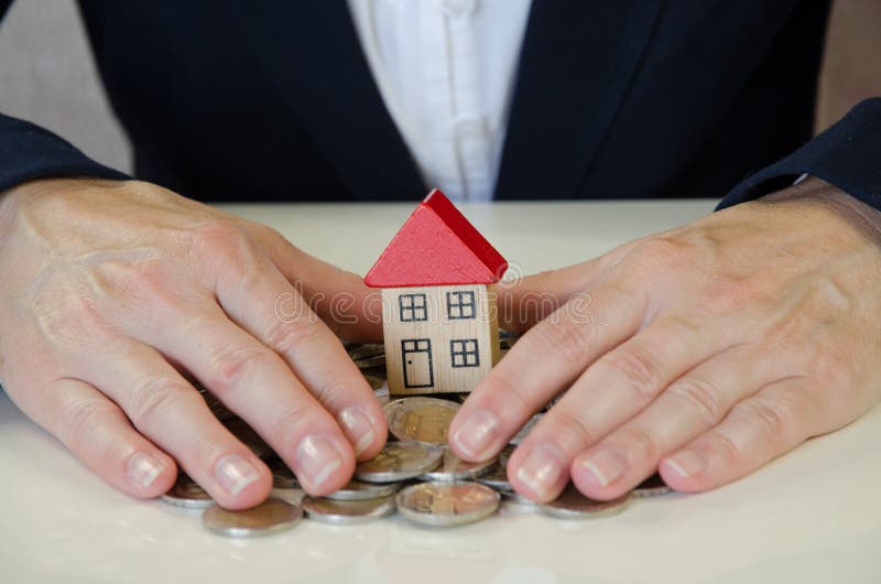 Hand, house and coins stock image. Image of euro, currency - 56909523
