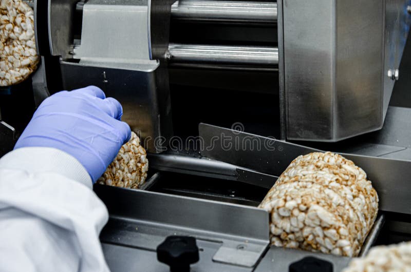 Hand of a Human in Glove Works on Conveyor. Automatic Line for the ...