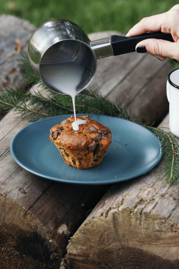 Hand Icing a Muffin Outdoors. Stock Image - Image of hand, muffin ...