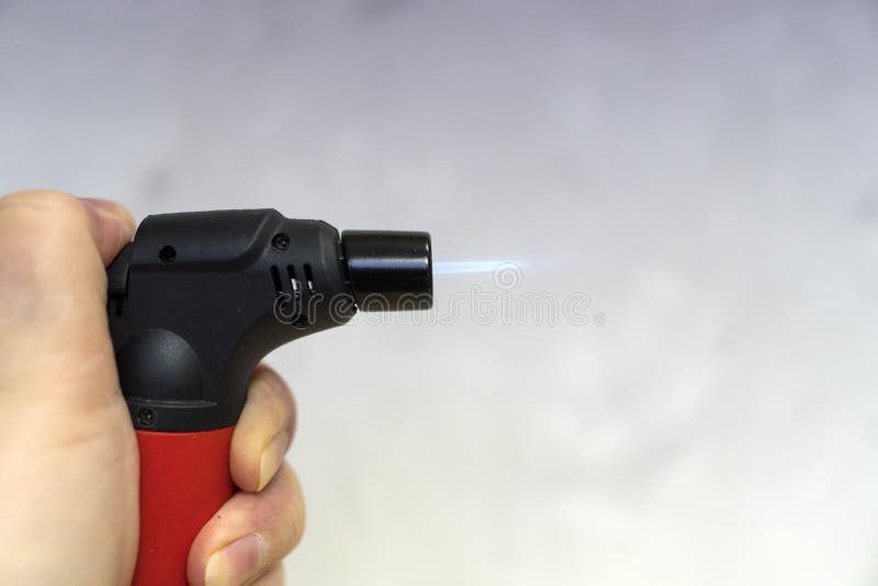 The Hand Includes a Lighter. the Fire is on. Stock Image - Image of ...