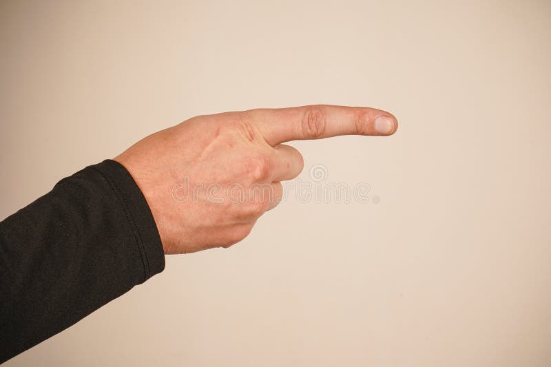 A Hand with the Index Finger Extended Forward Creates a Gesture of ...