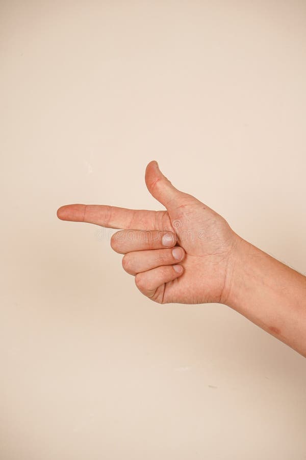 A Hand with the Index Finger Extended Forward Creates a Gesture of ...