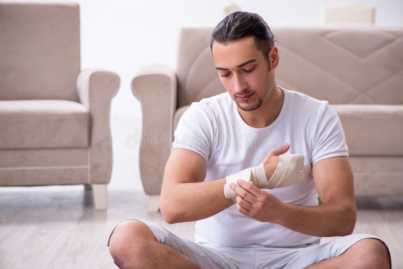 Hand Injured Man Doing Exercises at Home Stock Image - Image of injured ...