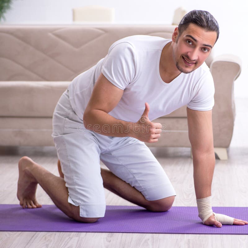 Hand Injured Man Doing Exercises at Home Stock Image - Image of bandage ...