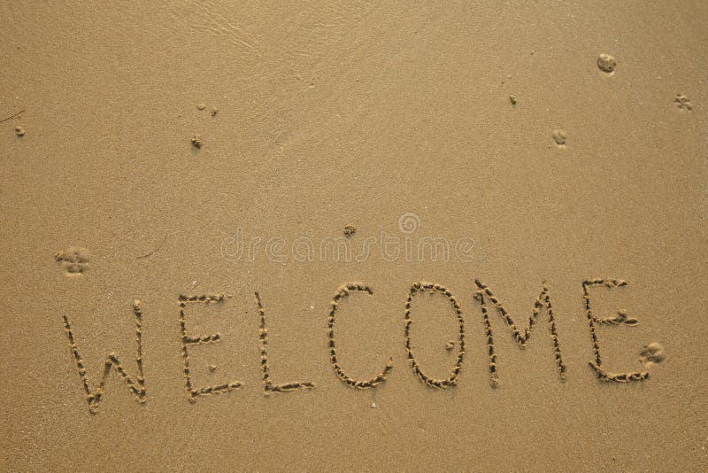 Hand Inscribed WELCOME on the Texture of Beach Sand. Stock Image ...