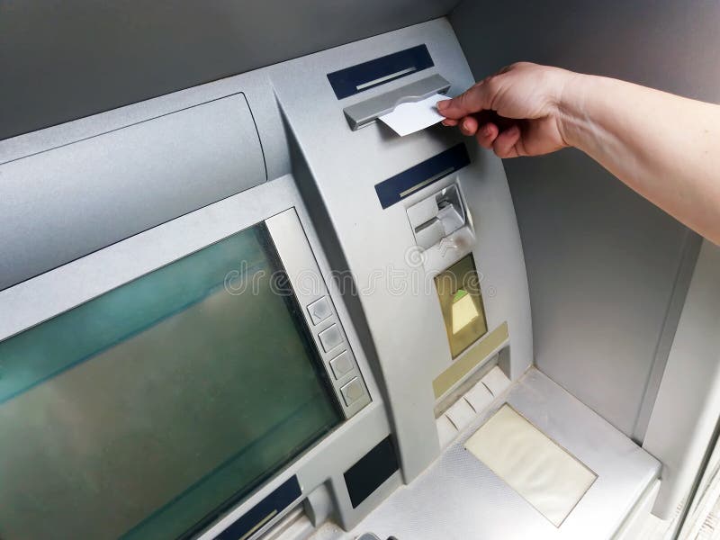 Hand Inserting ATM Card into Bank Machine To Withdraw Money Stock Image ...