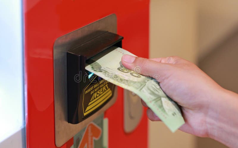 Hand Inserting Banknote into Vending Machine Stock Photo - Image of ...