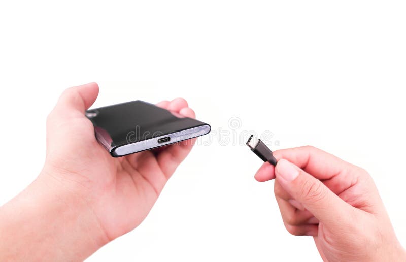 Hand Inserting the Charging Cable into the Type C Port of a Smartphone ...
