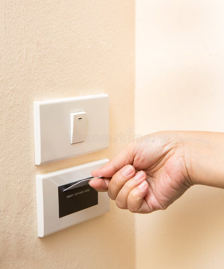 A Hand Inserting Keycard In The Electronic Lock Stock Photo - Image of ...