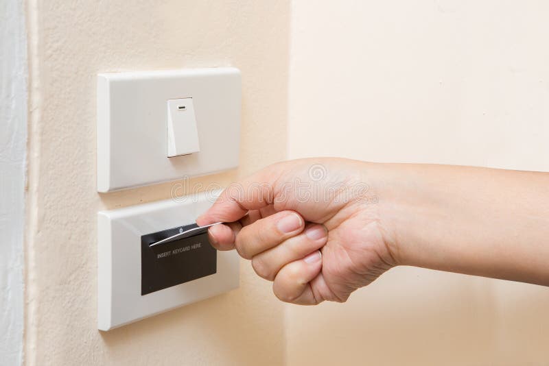 A Hand Inserting Keycard in the Electronic Lock Stock Photo - Image of ...