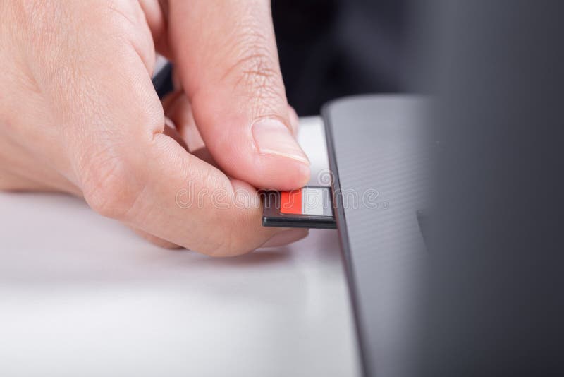 Hand Inserting SD Card into Laptop Stock Photo - Image of card ...